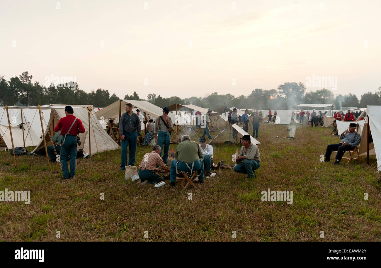 Soldiers breakfast at sunrise at a Civil War reenactment encampment ...