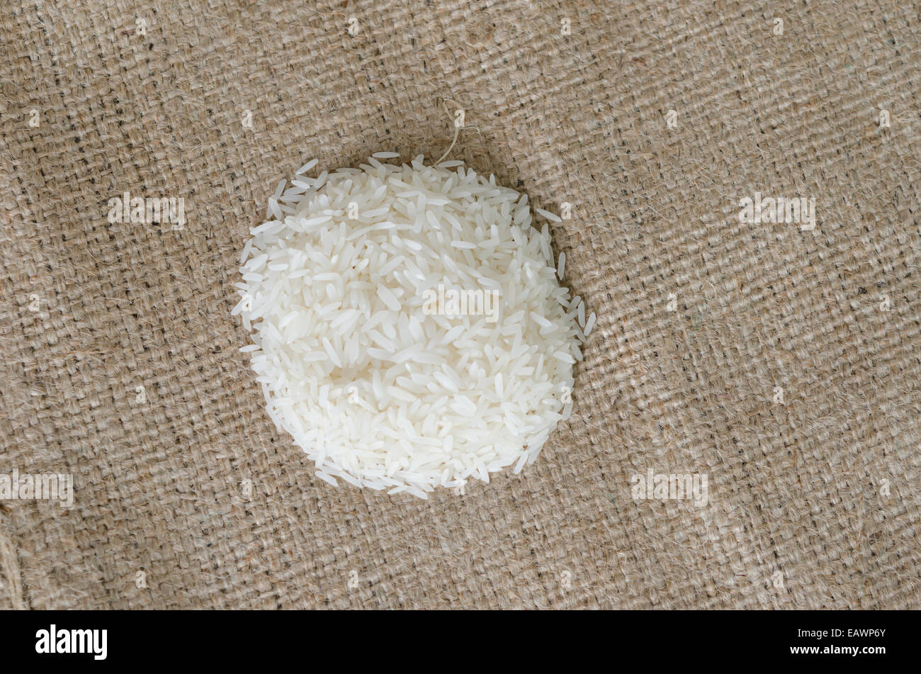white rice grains on sackcloth Stock Photo - Alamy
