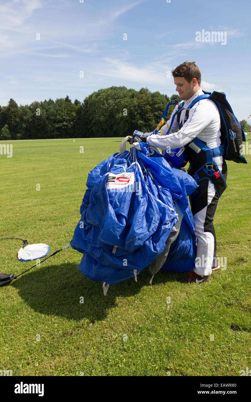 This skydiver landed with his parachute and is now very happy to be ...