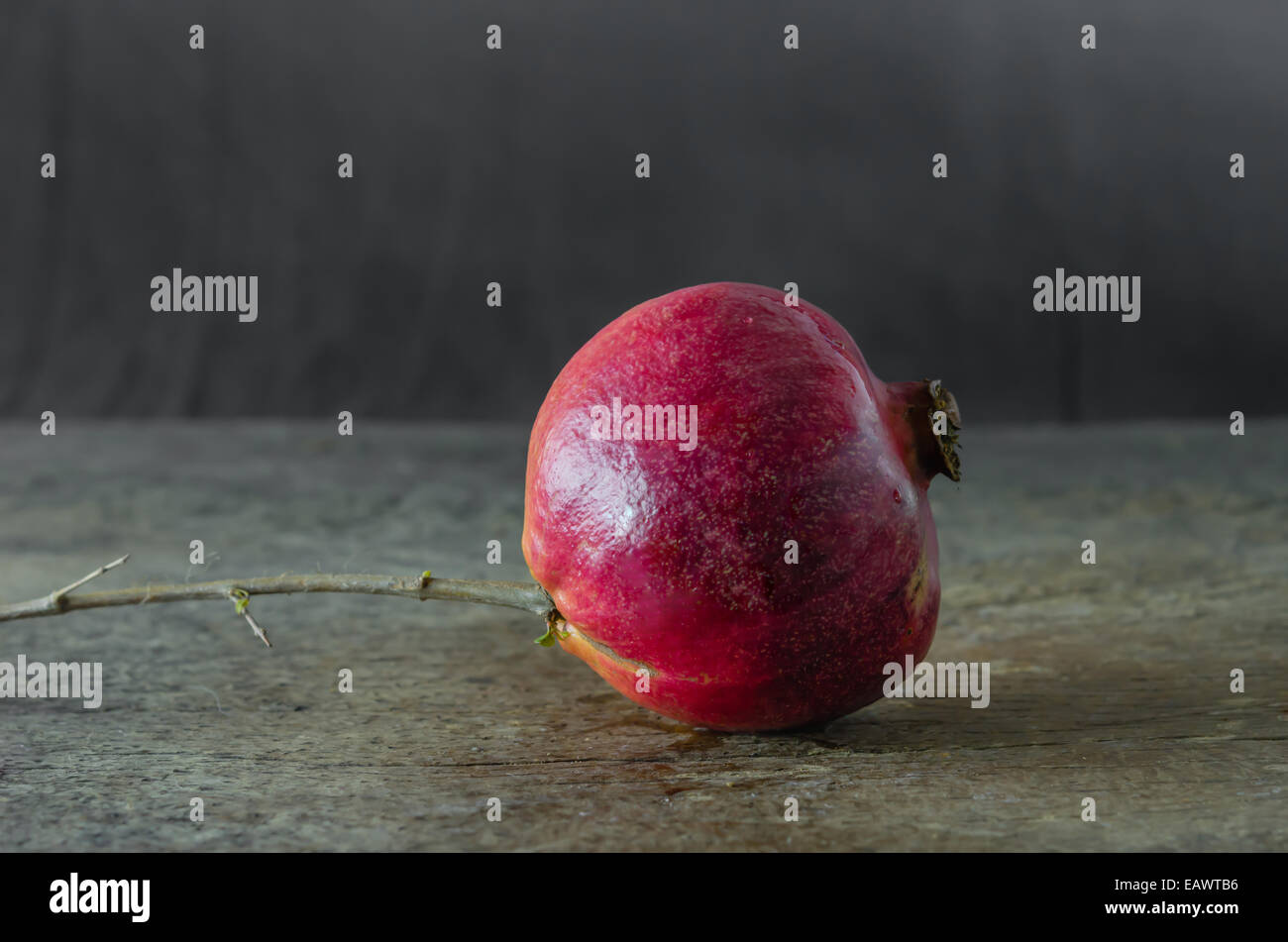 still life of pomegranate on wooden background Stock Photo - Alamy