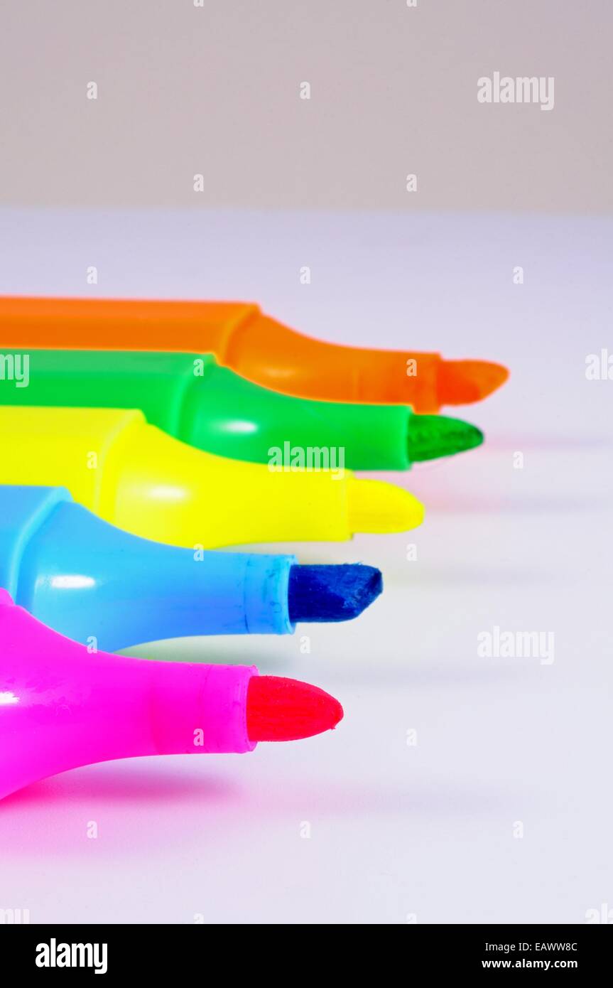 Highlighter pens with caps removed against a white background Stock ...