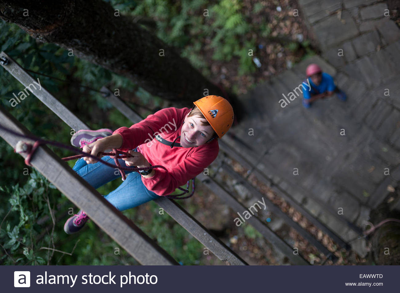A Woman Climbing Up A Ladder Stock Photos & A Woman Climbing Up A ...