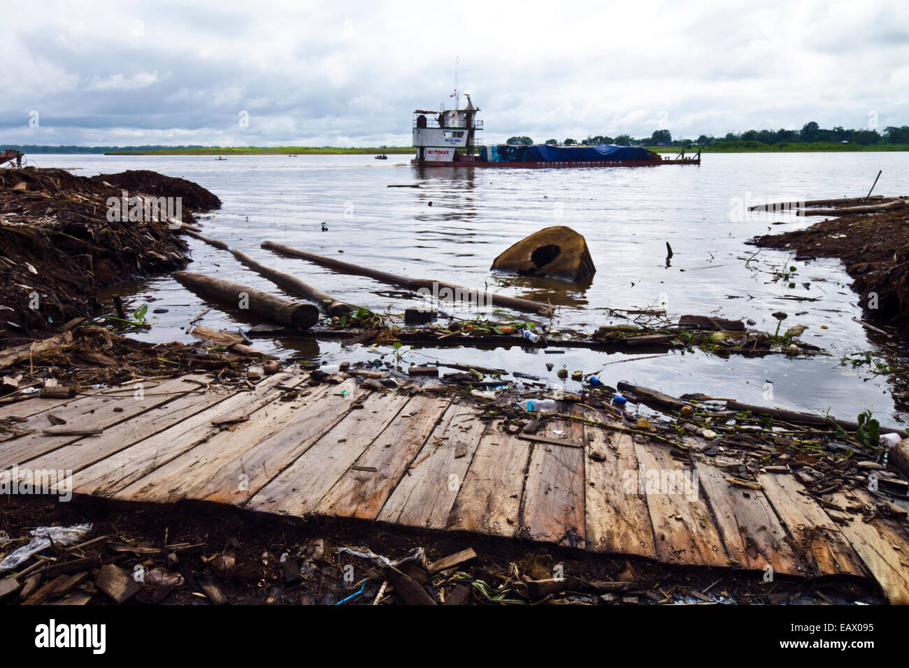 A barge with logs and pollution along the Amazon River Stock Photo - Alamy