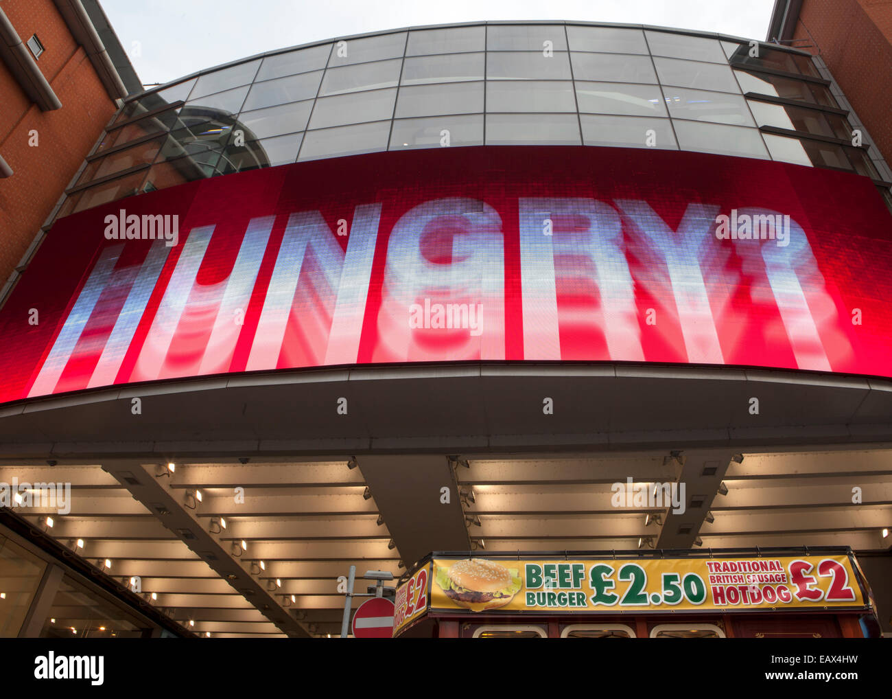 LED sign displaying 'HUNGRY' with beef burger kiosk underneath, Market ...