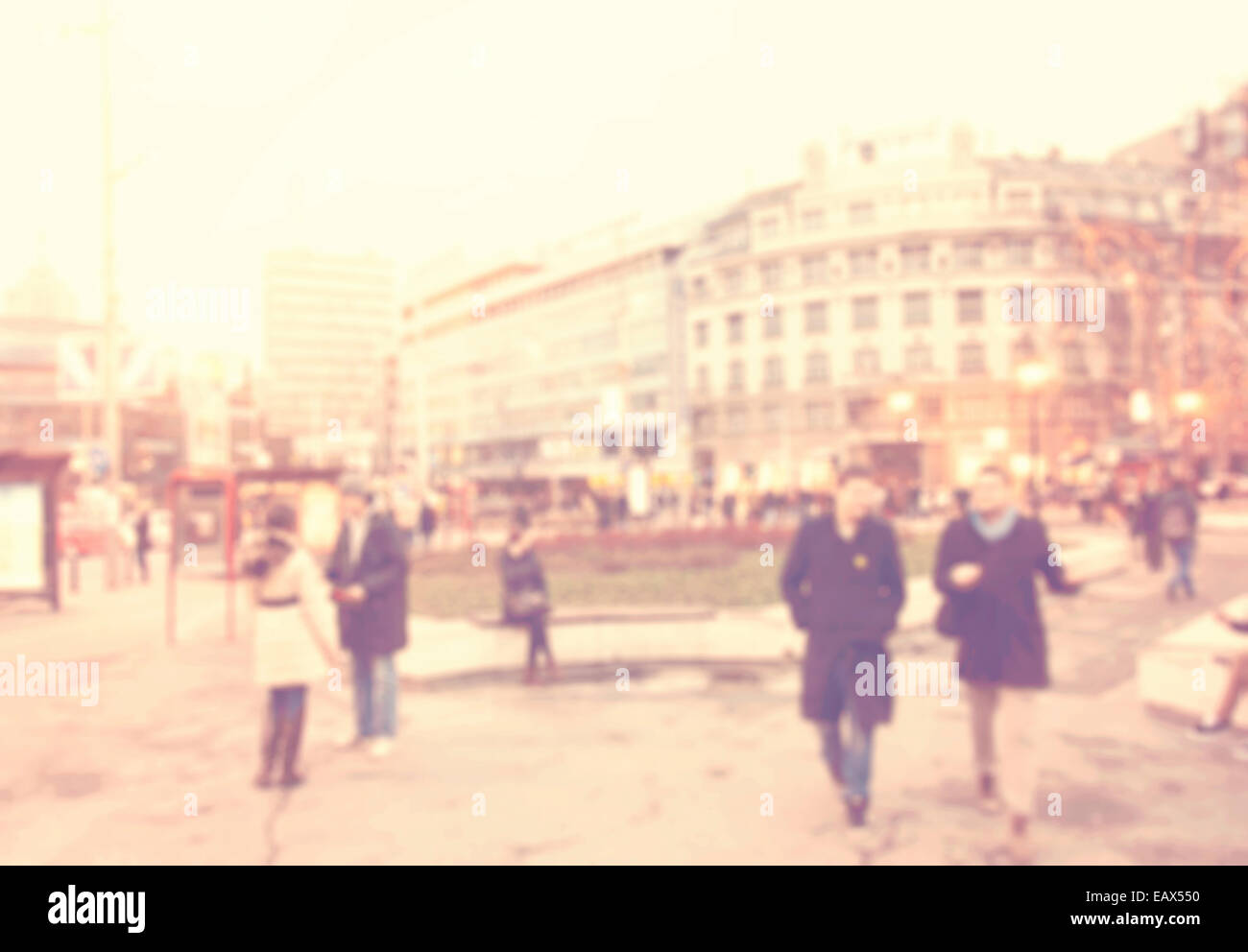 Sun and people in the city vintage blurred background Stock Photo - Alamy