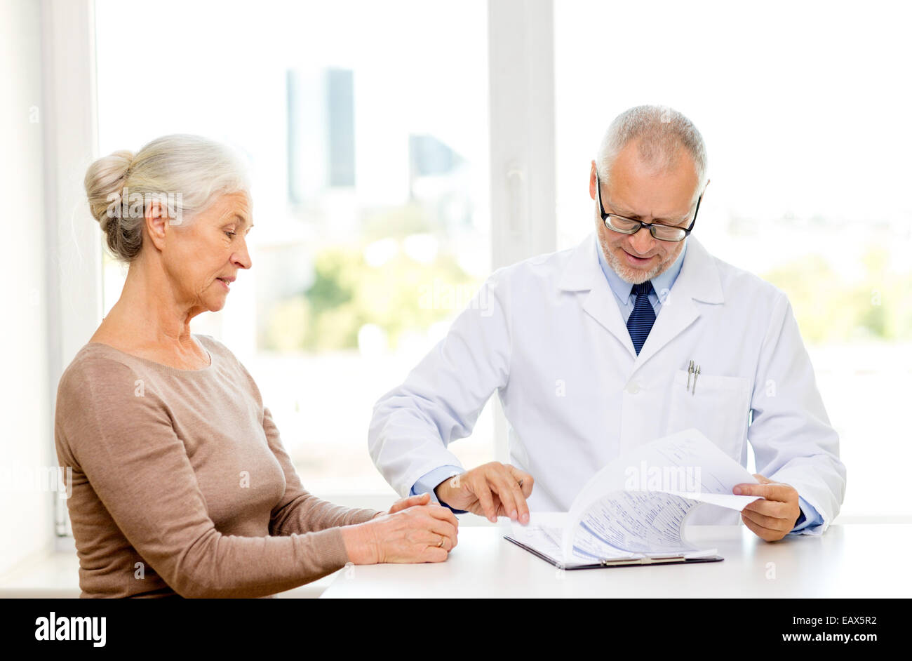 Senior doctor prescribing medication elderly hi-res stock photography ...