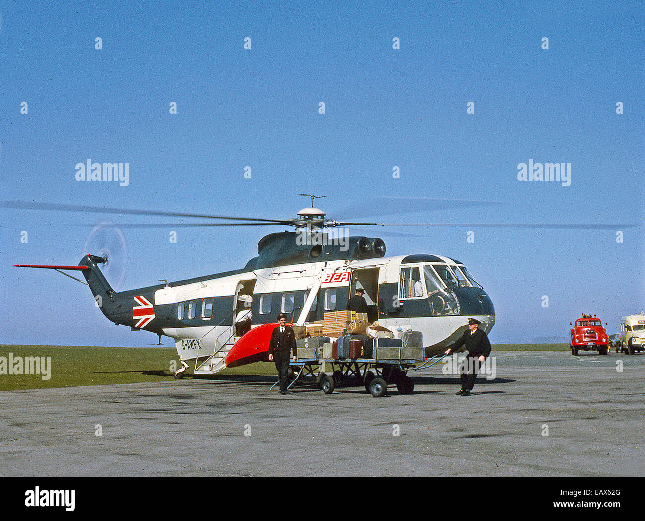 B E A helicopter unloading Scilly Isles Stock Photo - Alamy