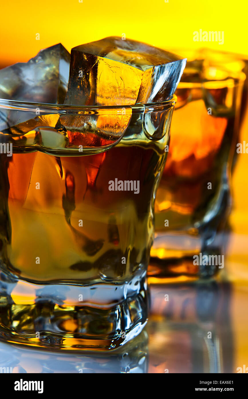 whisky with ice , focus on a foreground Stock Photo - Alamy