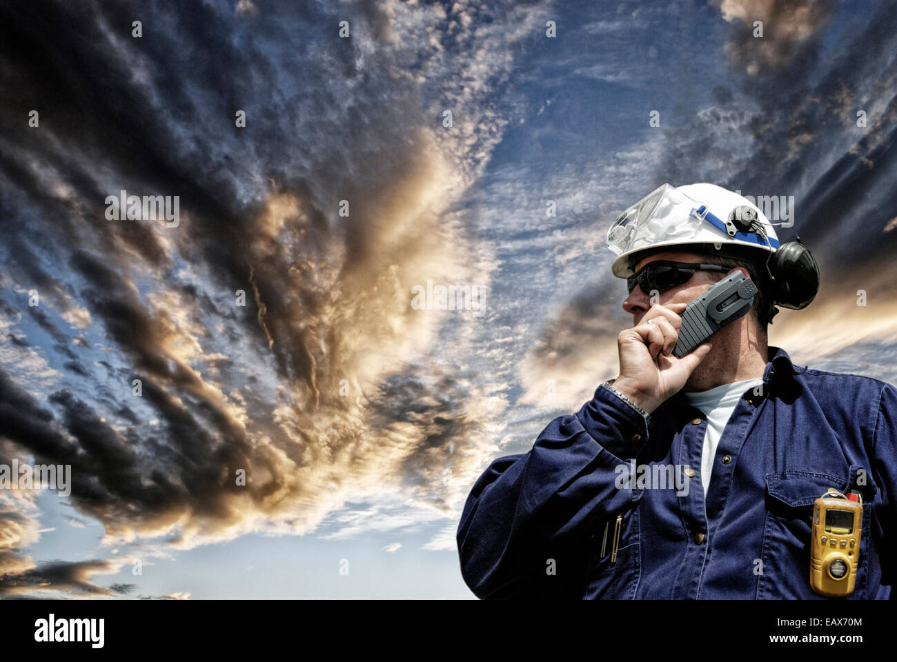 engineer, worker with dark industrial sky and clouds Stock Photo - Alamy