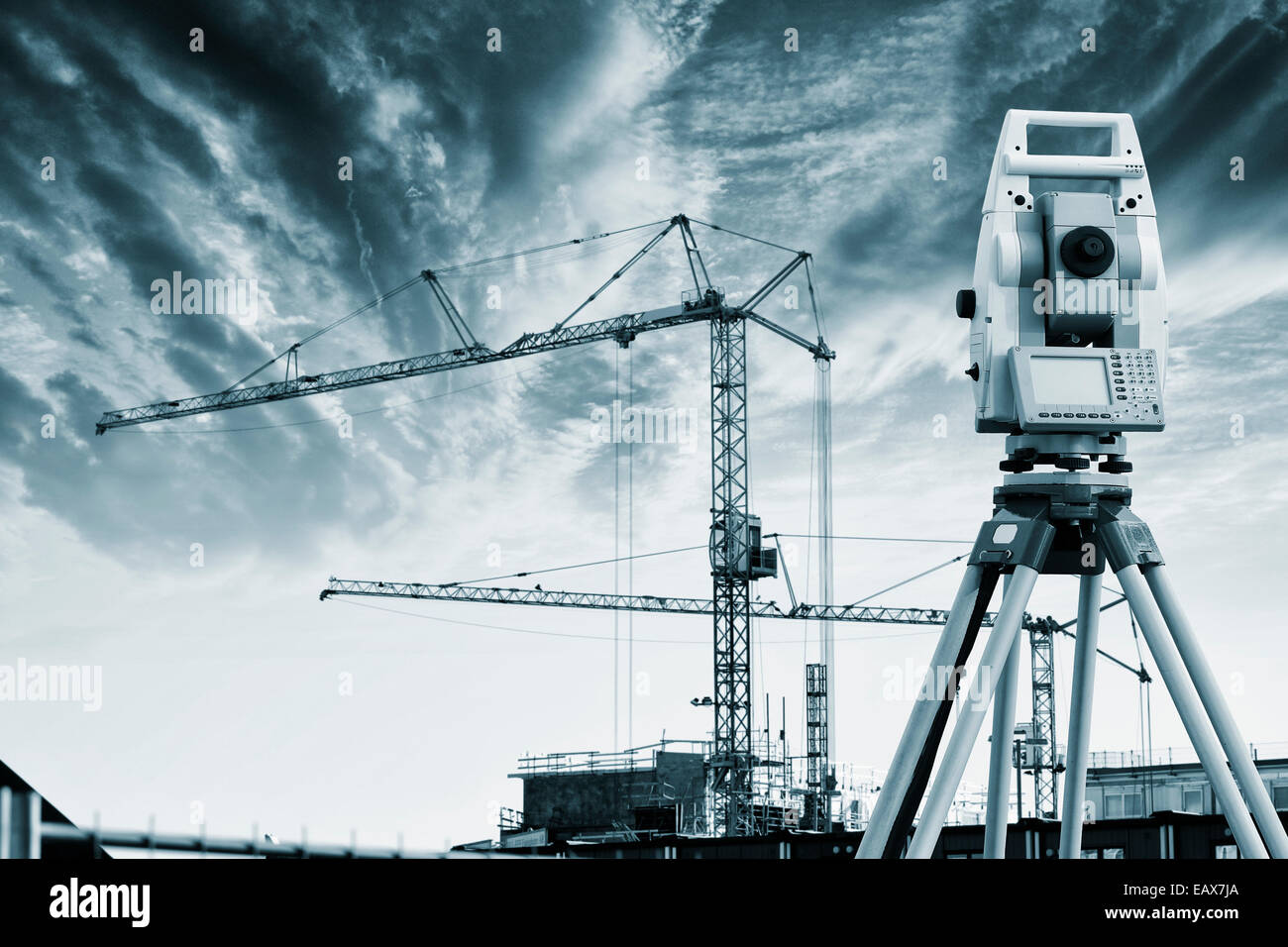 surveyors measuring instrument inside building site Stock Photo - Alamy