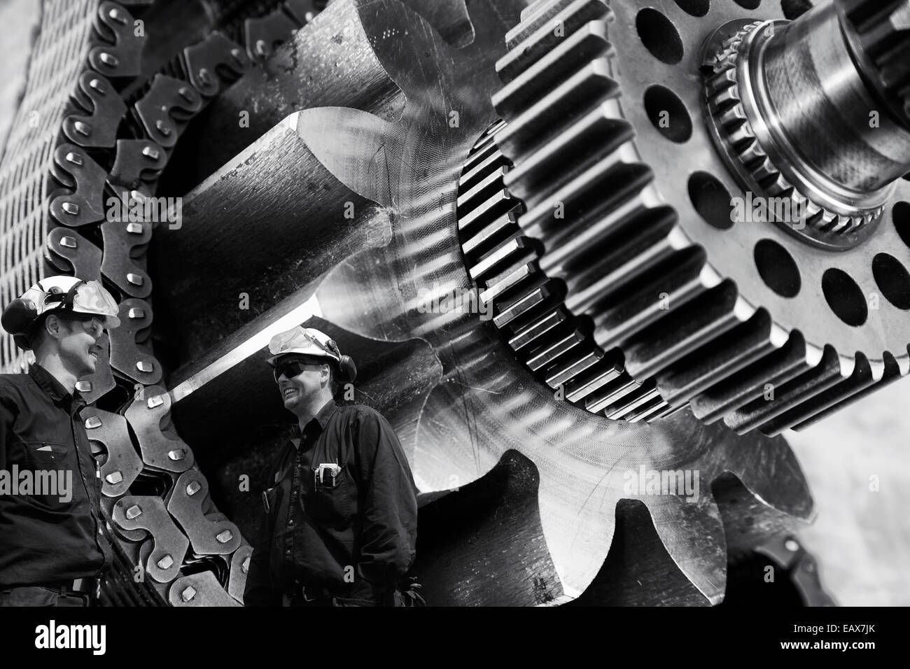 industry workers with cogwheels machinery Stock Photo - Alamy