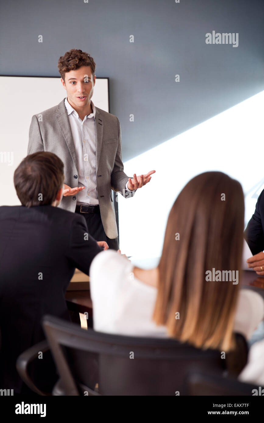 Businessman presenting at business meeting Stock Photo - Alamy