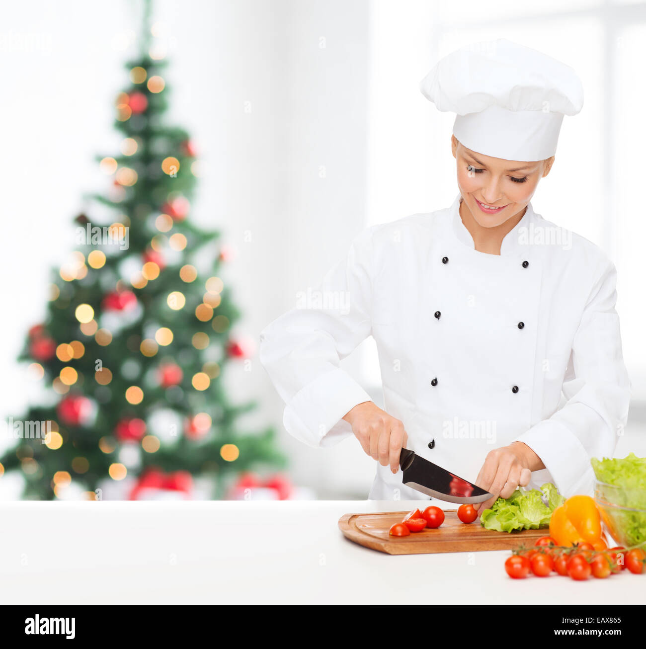 Professional chef cutting tomatoes hi-res stock photography and images ...