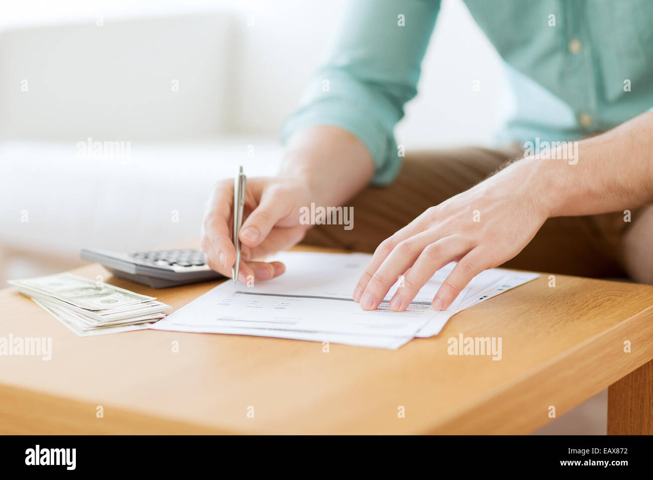 close up of man counting money and making notes Stock Photo - Alamy