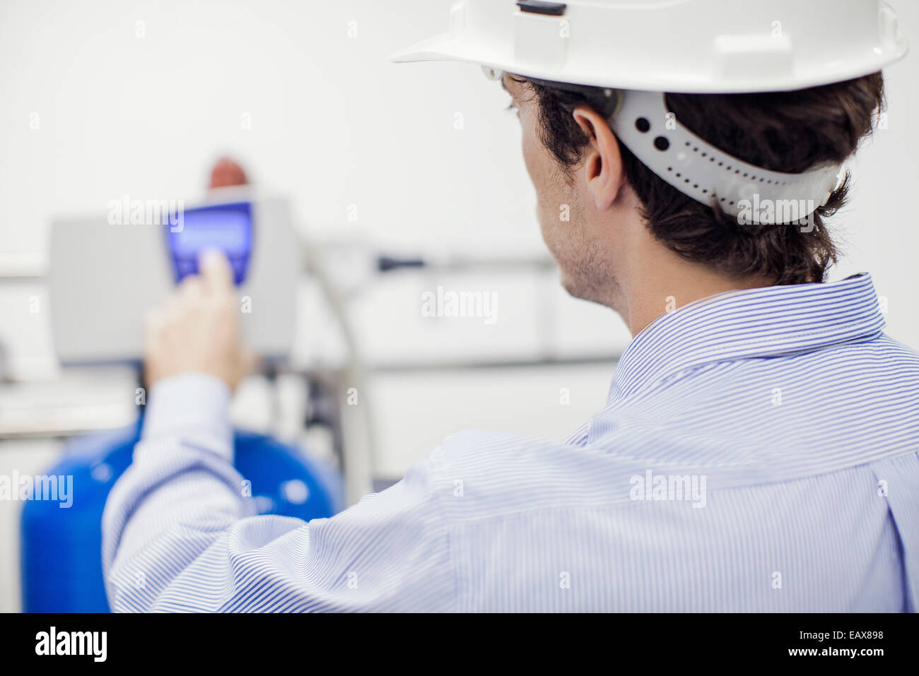 Technicians working industrial equipment hi-res stock photography and ...