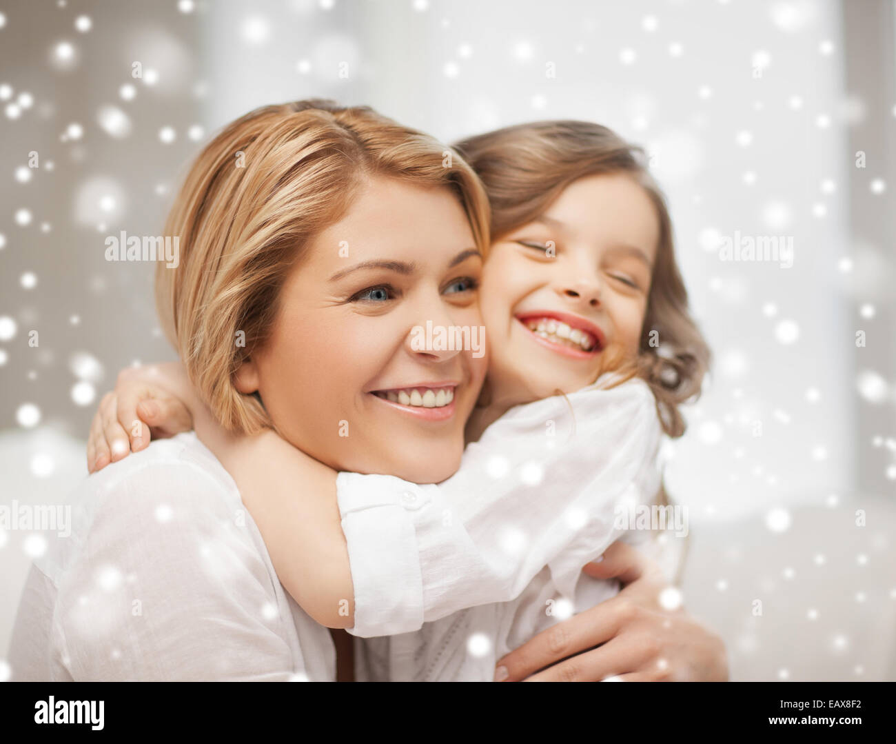 happy mother and daughter hugging at home Stock Photo - Alamy