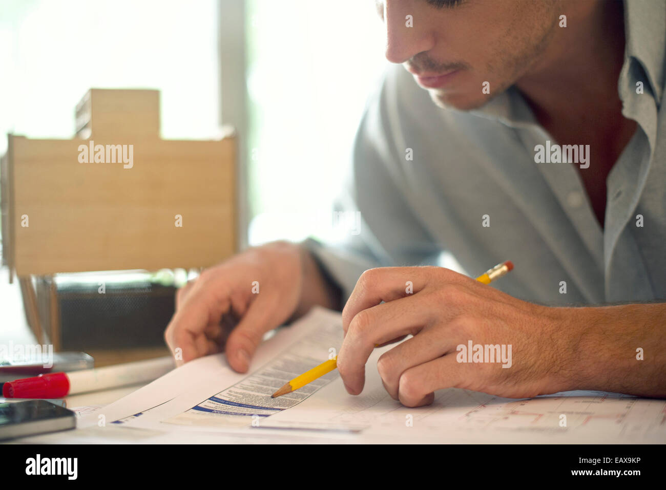 Businessman working on paperwork Stock Photo - Alamy