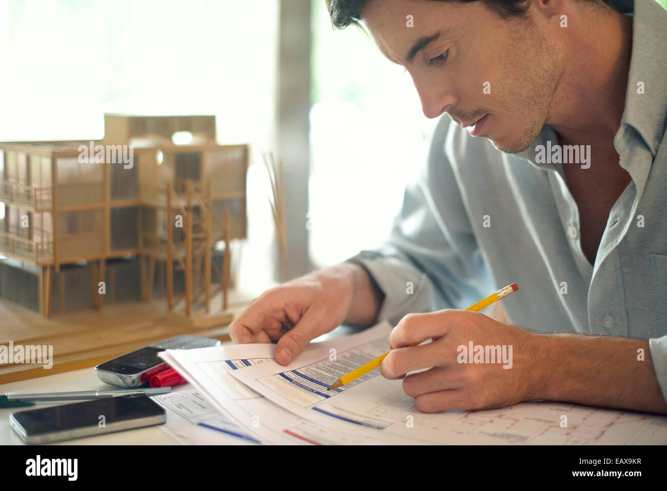 Businessman working on paperwork Stock Photo - Alamy