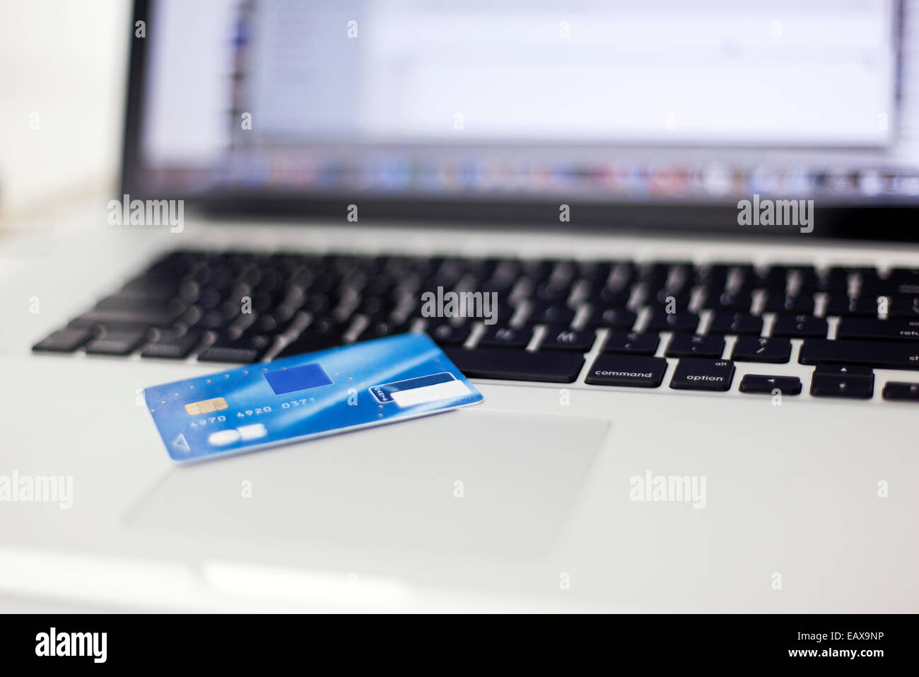 Credit card resting on laptop computer Stock Photo - Alamy