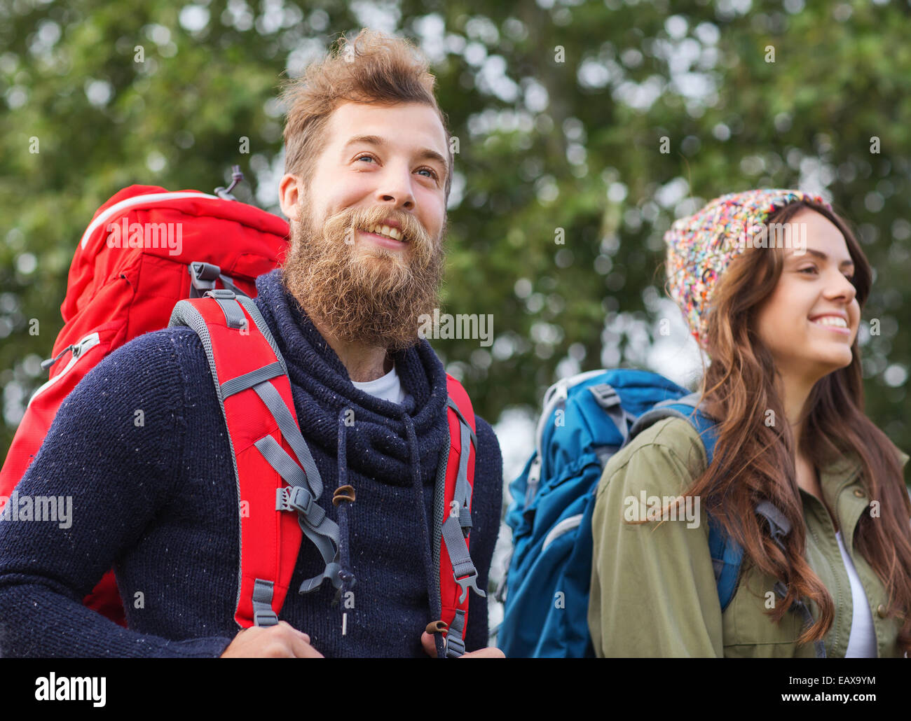 group of smiling friends with backpacks hiking Stock Photo - Alamy