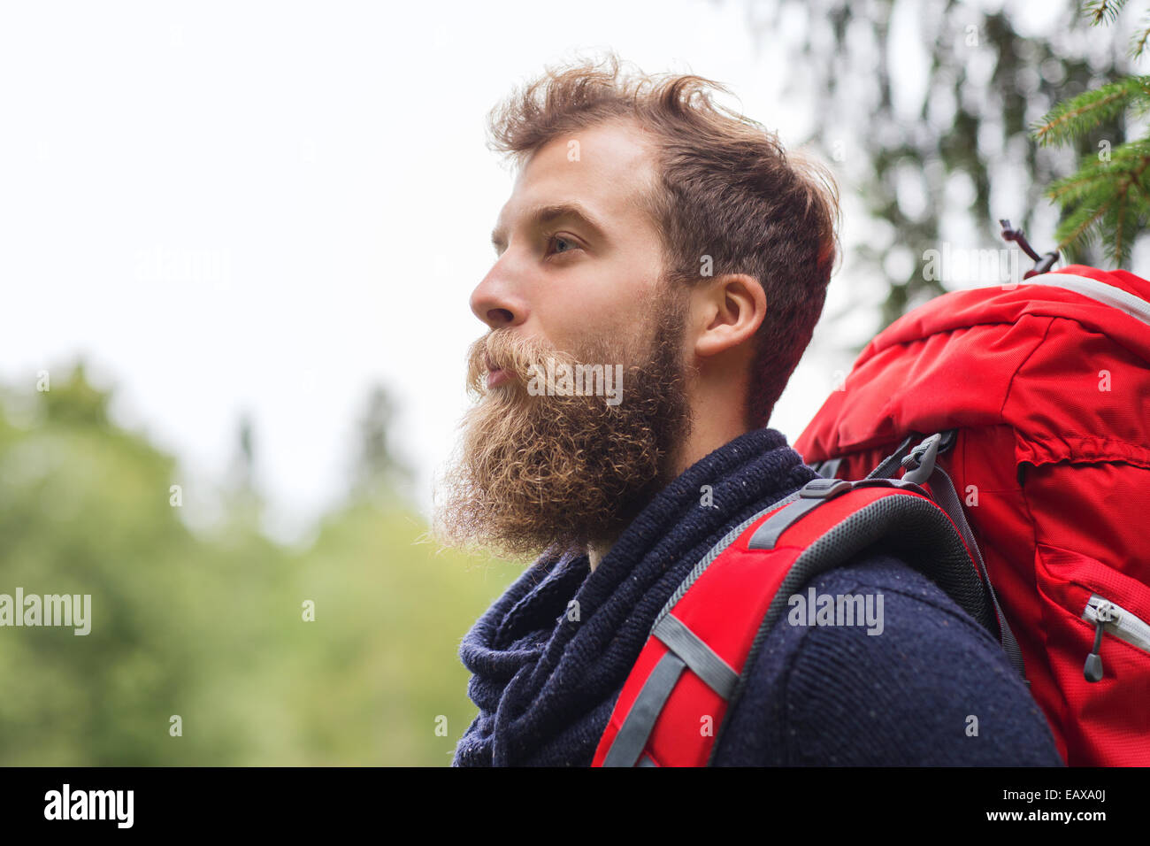 smiling man with beard and backpack hiking Stock Photo - Alamy