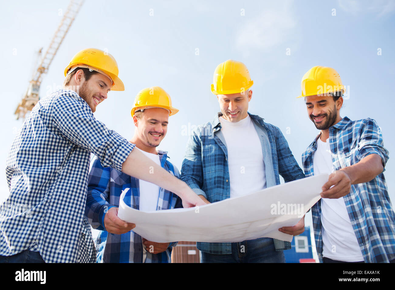 Group young builders discussing hi-res stock photography and images - Alamy