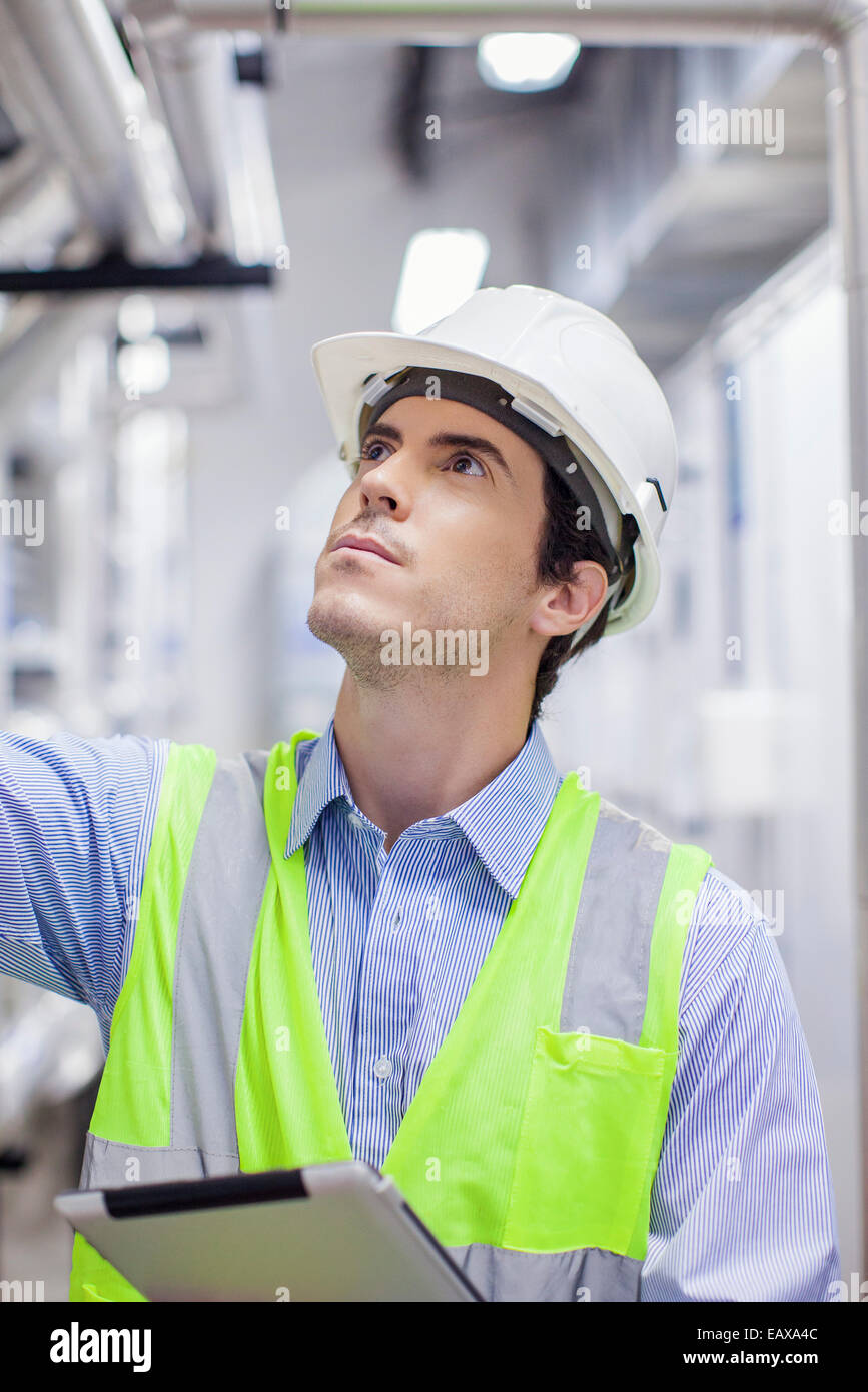 Worker inspecting tablets hi-res stock photography and images - Alamy