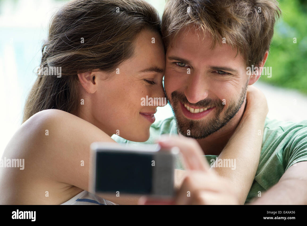 Young couple taking selfie with digital camera Stock Photo - Alamy