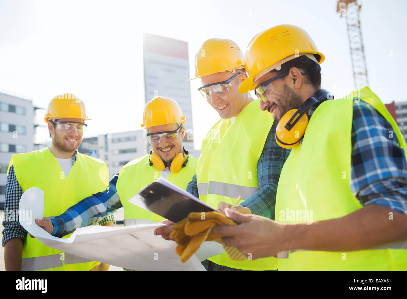 group of builders with tablet pc and blueprint Stock Photo - Alamy
