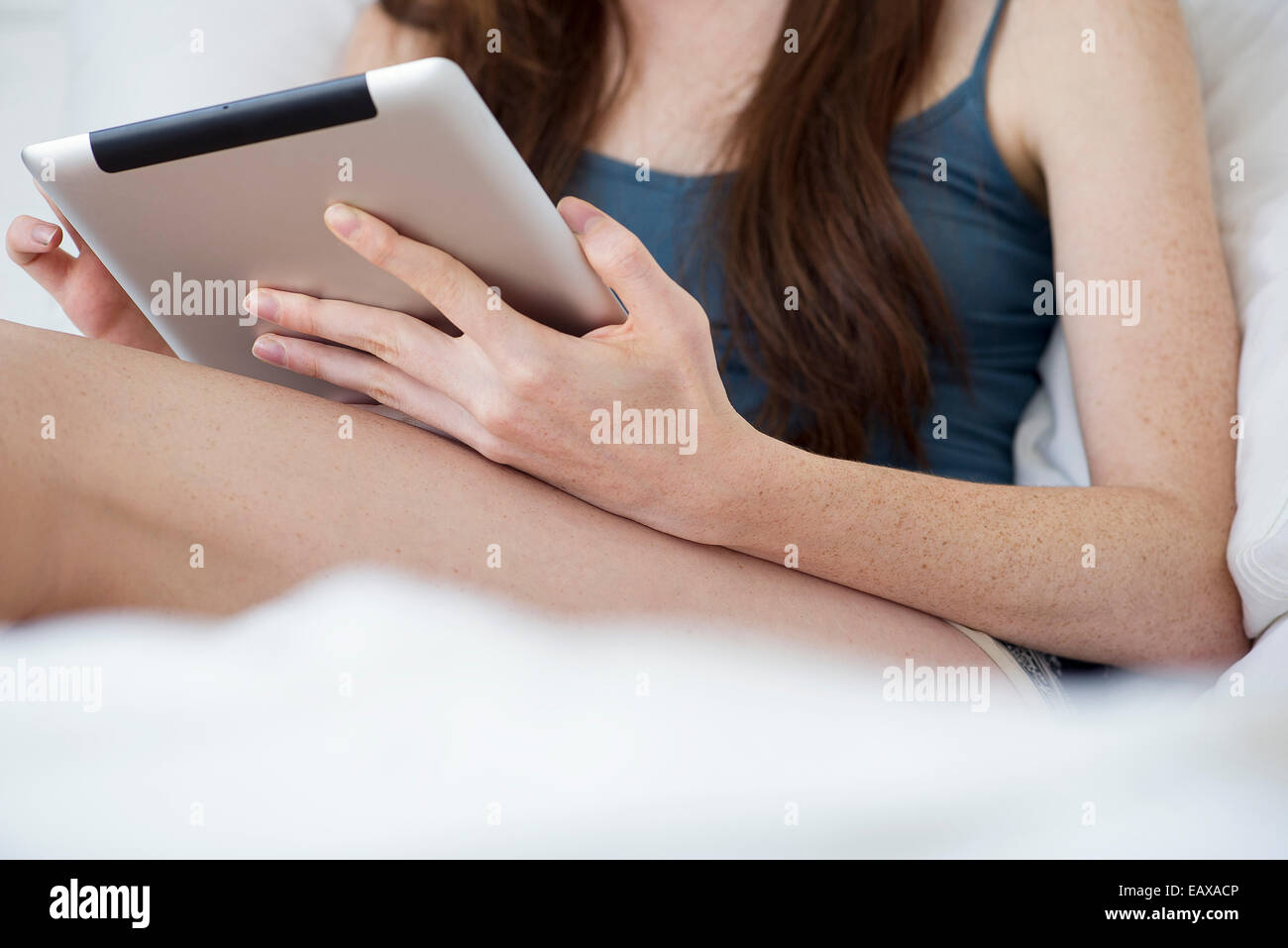 Woman using digital tablet Stock Photo - Alamy