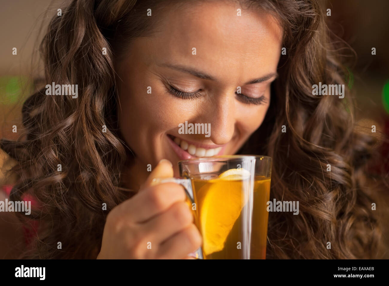 Happy young woman drinking tea hi-res stock photography and images - Alamy