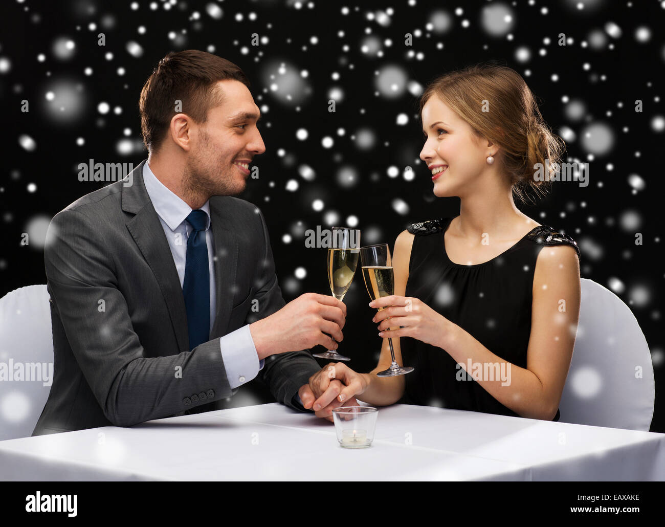 smiling couple at restaurant Stock Photo - Alamy