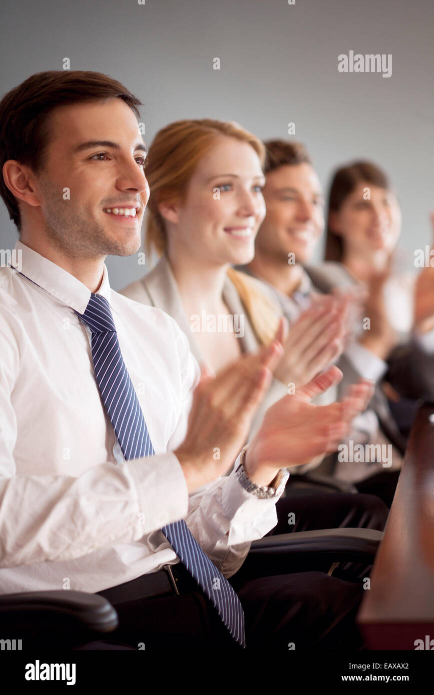 Young business professionals applauding during presentation Stock Photo ...