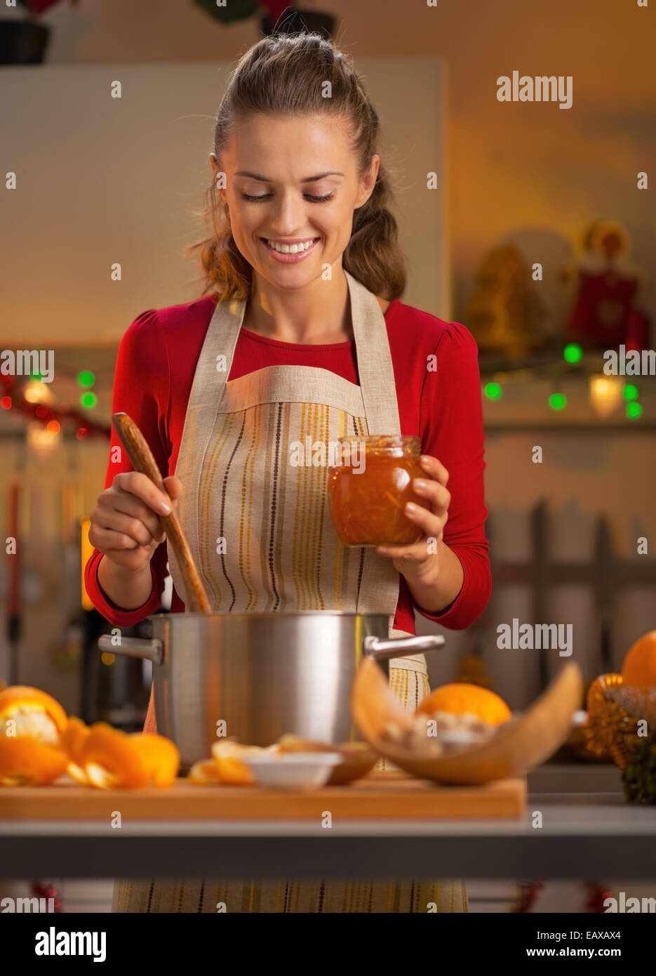Woman making jam in kitchen hi-res stock photography and images - Alamy