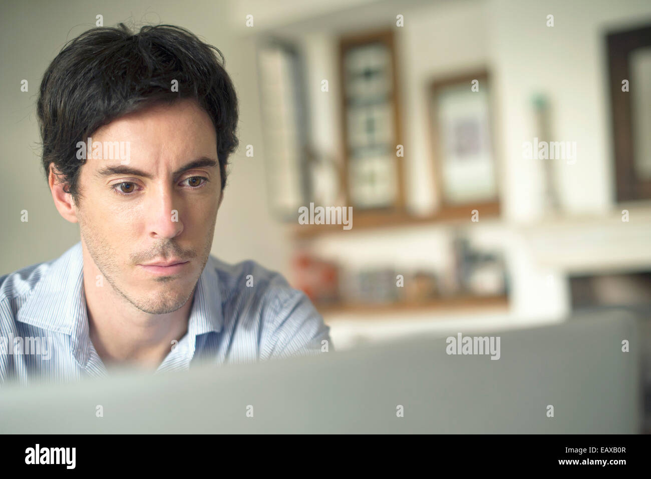 Man staring at laptop computer Stock Photo - Alamy