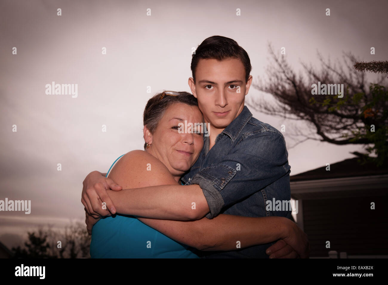 Mom and son hugging Stock Photo - Alamy