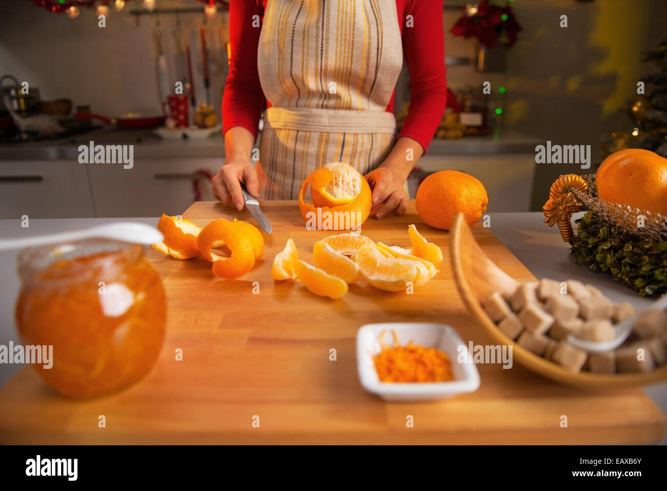 Closeup on young housewife making orange jam Stock Photo - Alamy