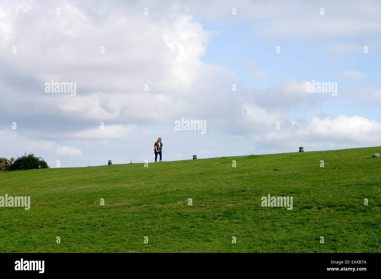 Woman walking along Cardiff Barrage, South Wales, UK Stock Photo - Alamy