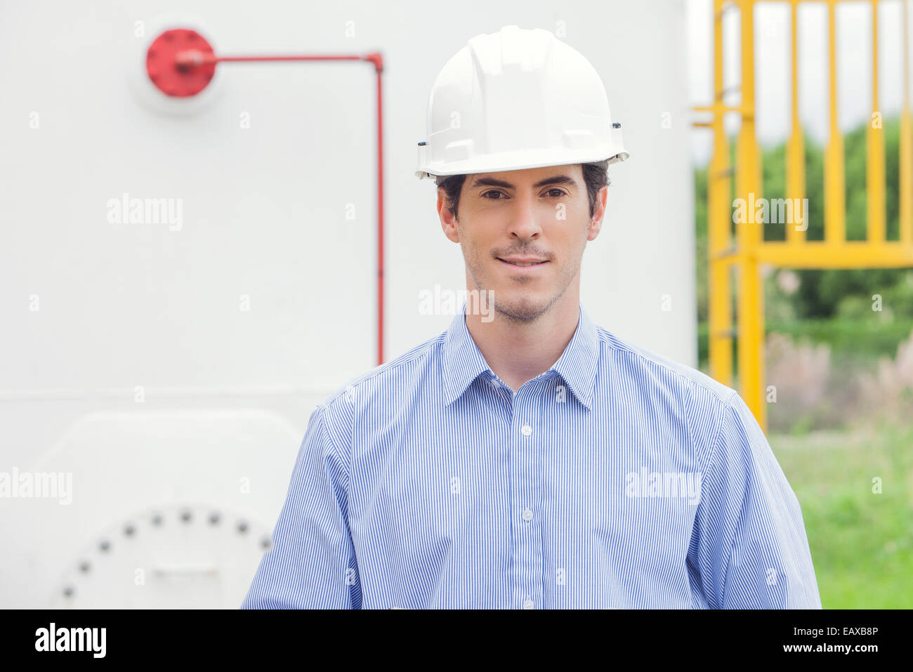 Engineer at industrial site, portrait Stock Photo - Alamy