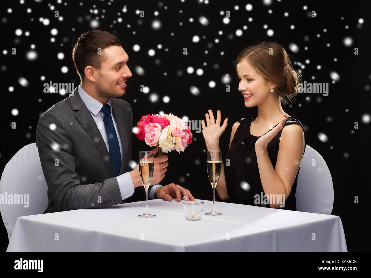 smiling couple at restaurant Stock Photo - Alamy
