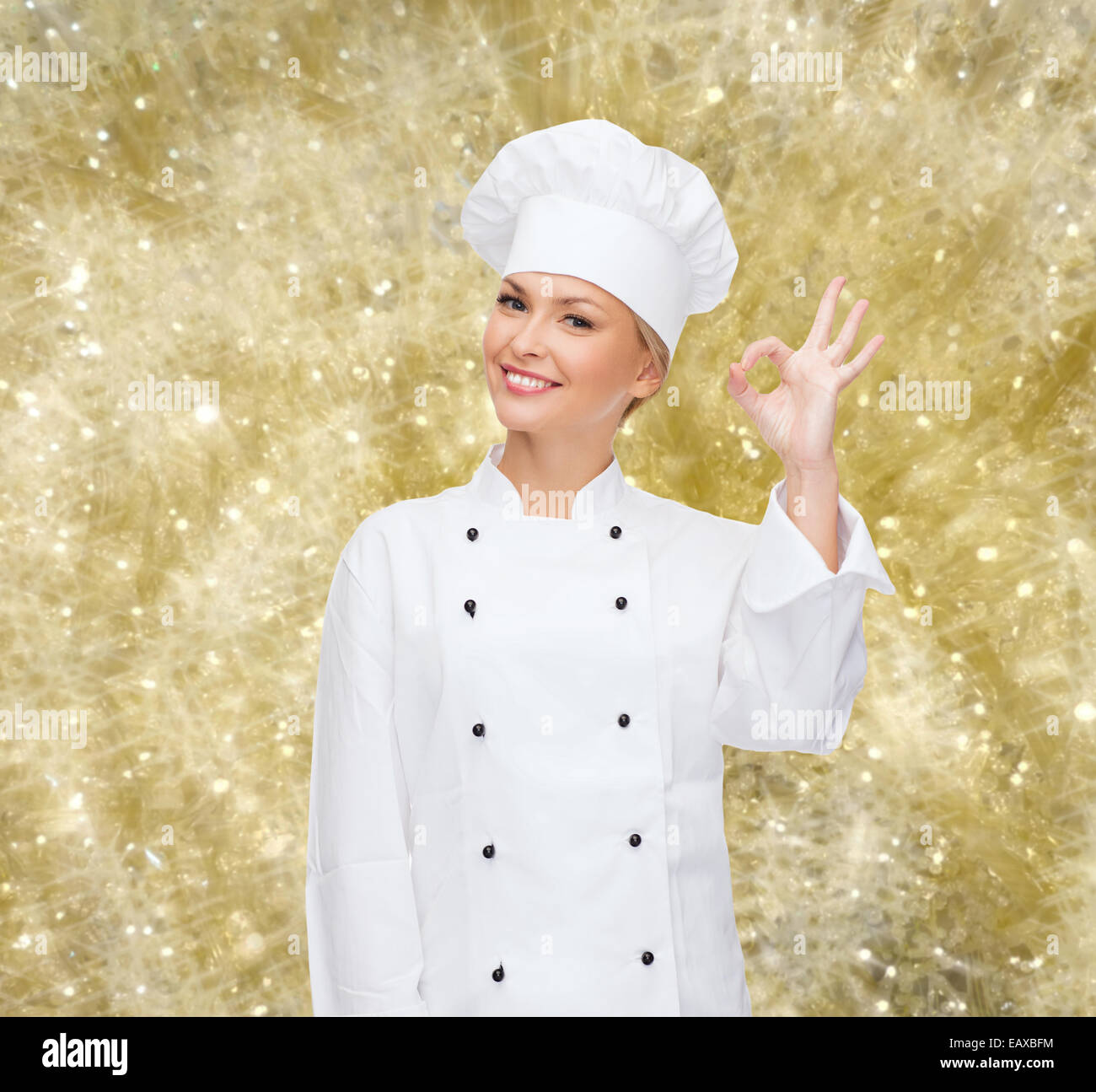 smiling female chef showing ok sign Stock Photo - Alamy