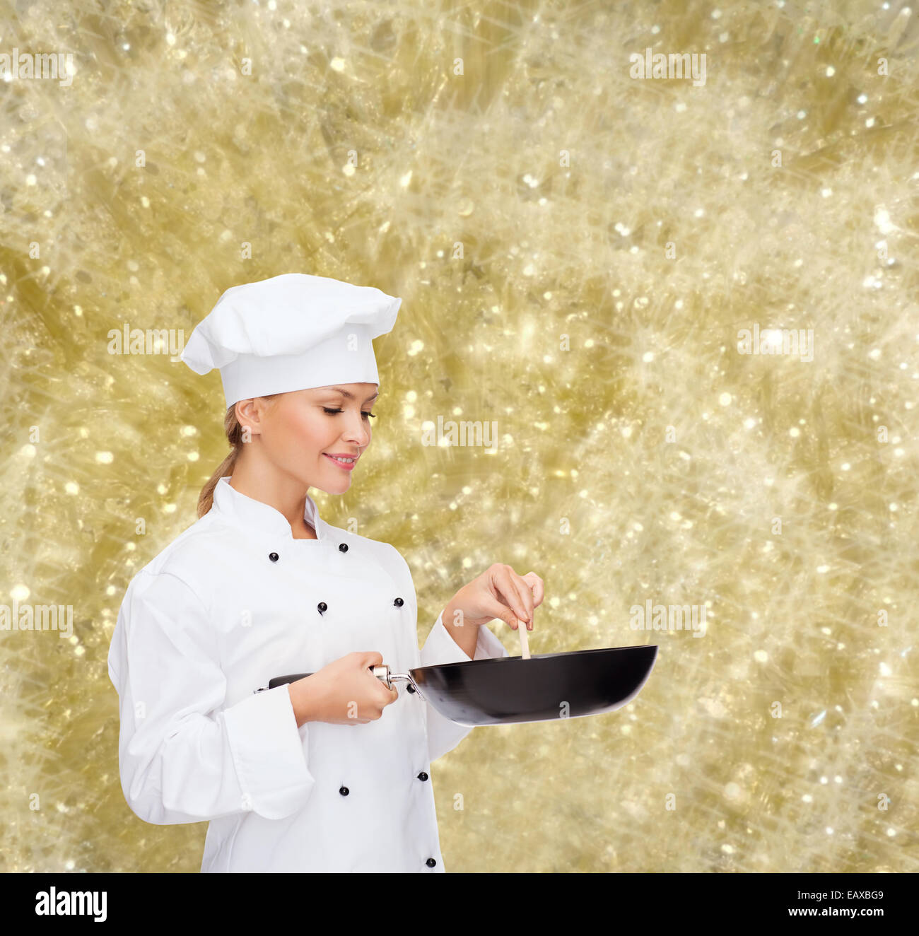 smiling female chef with pan and spoon Stock Photo - Alamy
