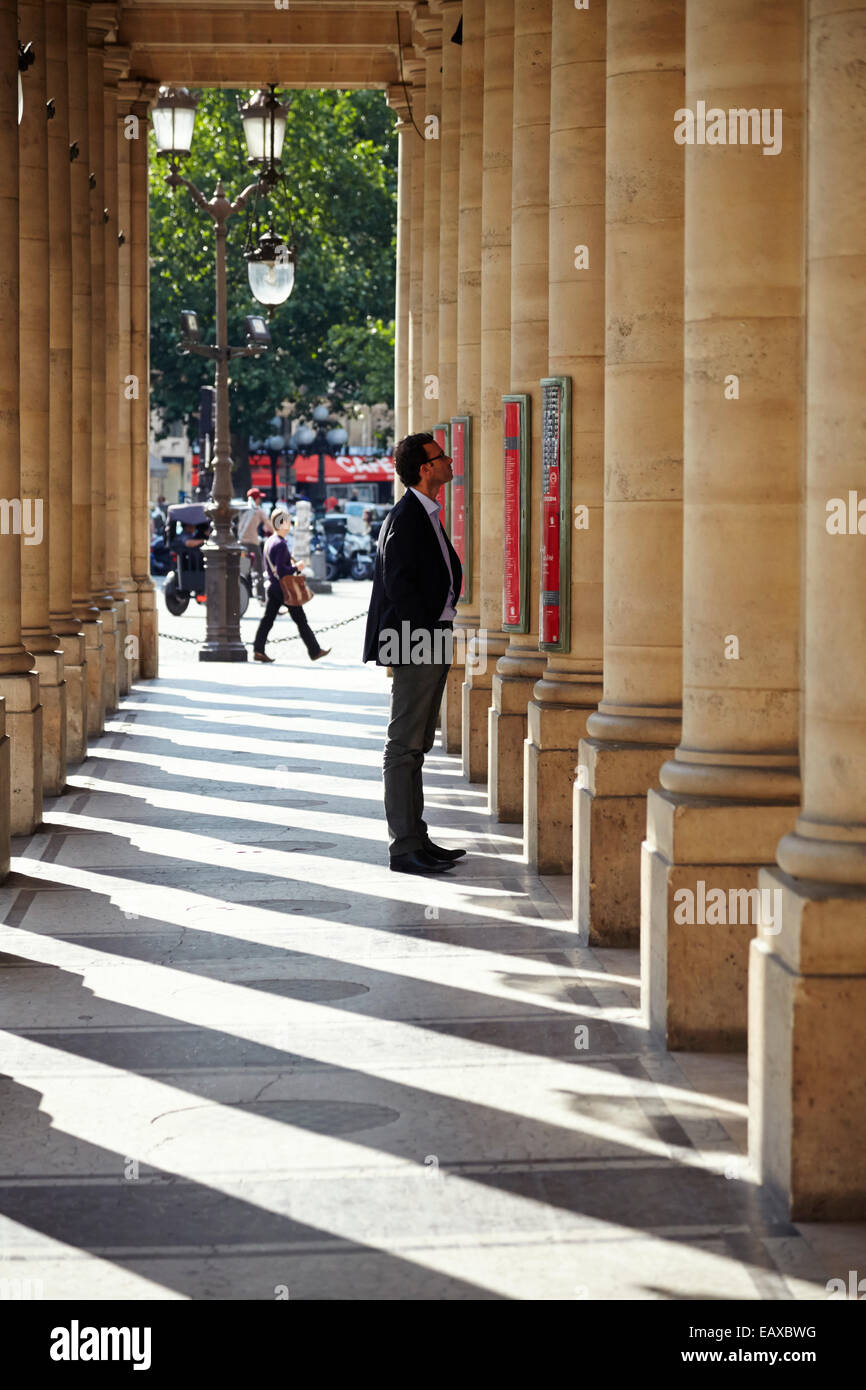 Man and columns in Paris Stock Photo - Alamy