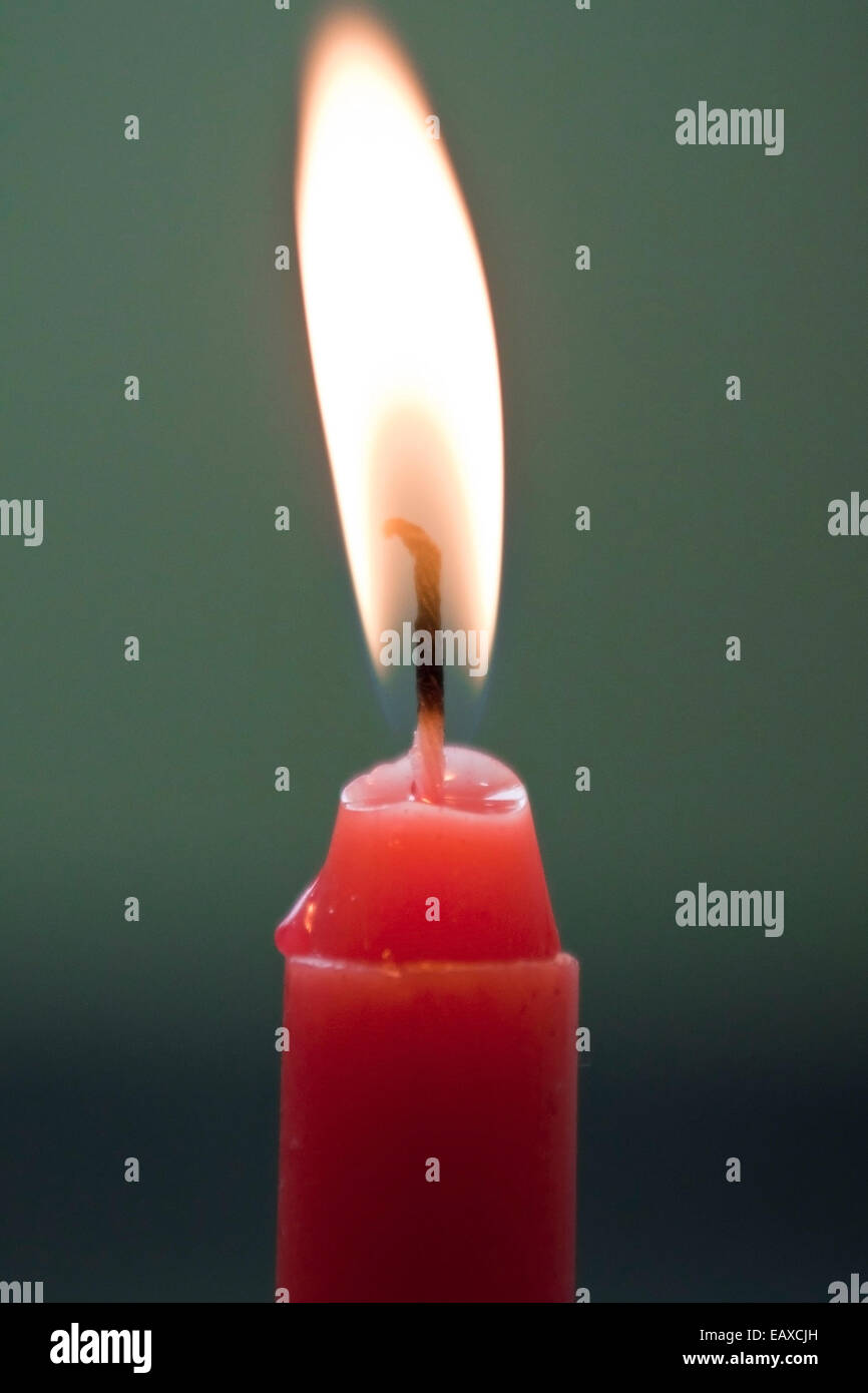 Red candle and flame isolated Stock Photo - Alamy