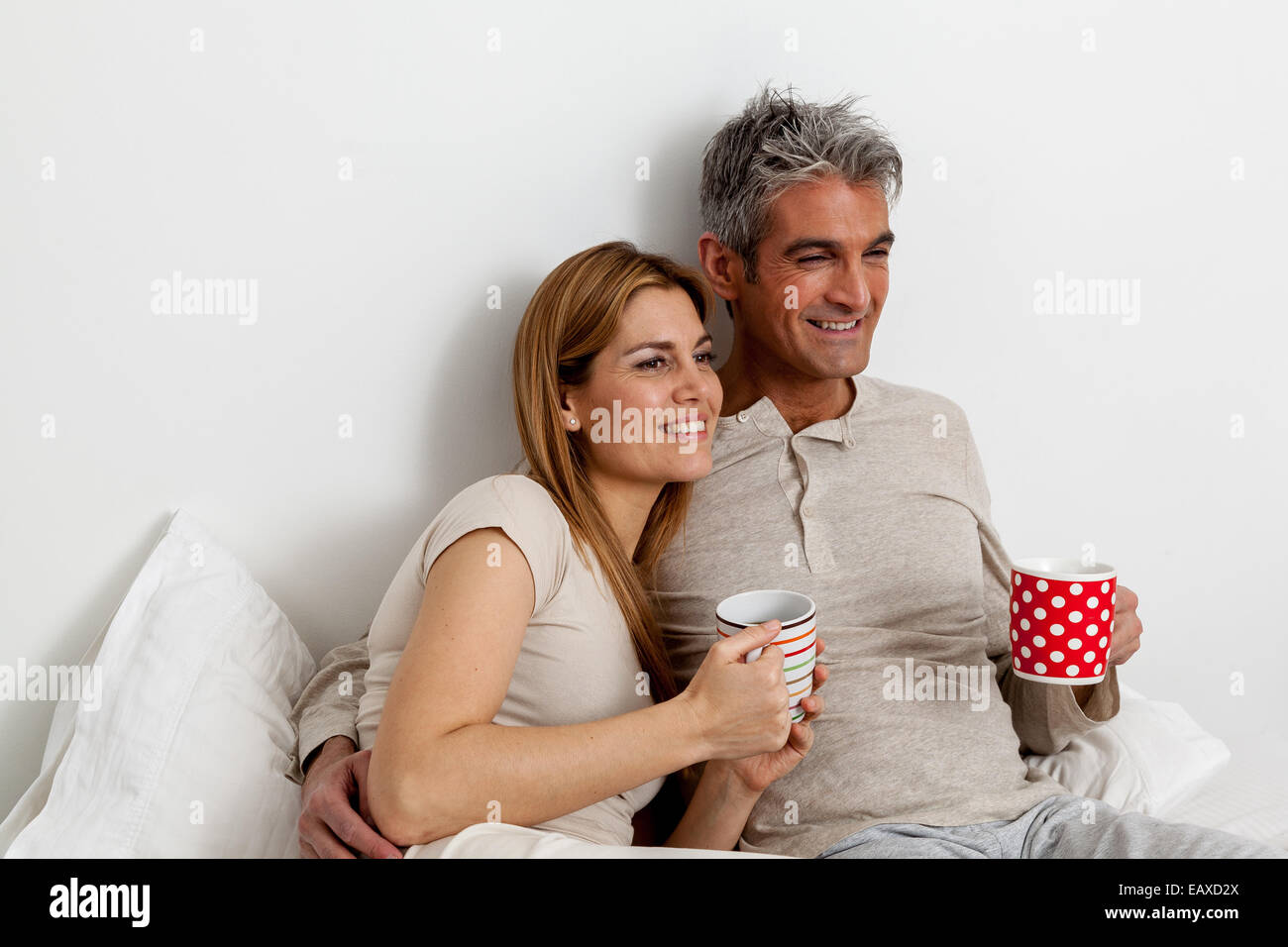Happy couple drinking tea in the bed Stock Photo - Alamy