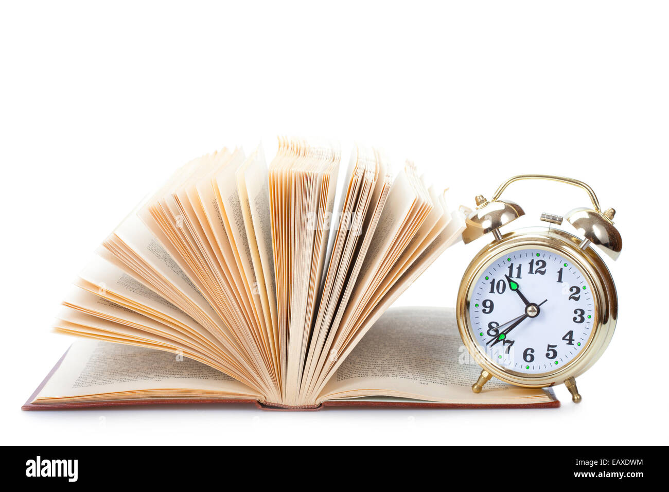 alarm clock to stand on the open book Stock Photo - Alamy