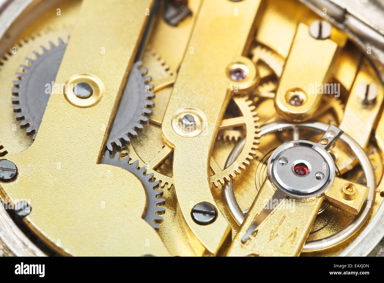 round brass clockwork of vintage pocket watch close up Stock Photo - Alamy