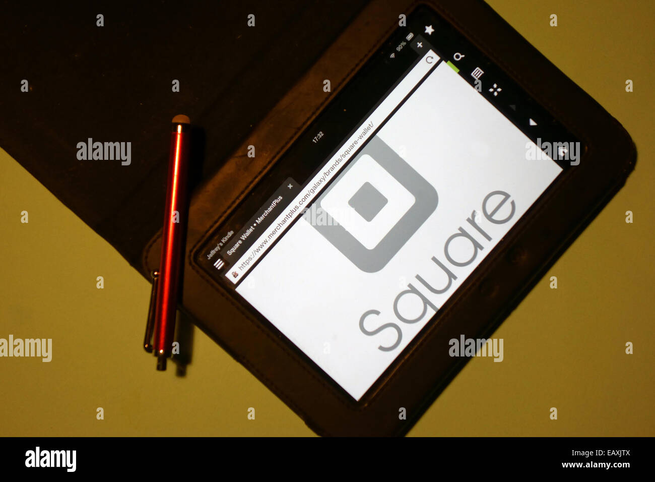 Square payments app logo shown on tablet screen with stylus, London ...