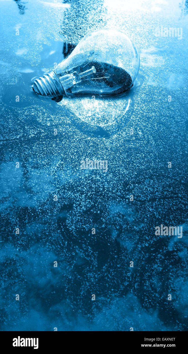 Lightbulb floating on water, represents symbiosis between electricity ...