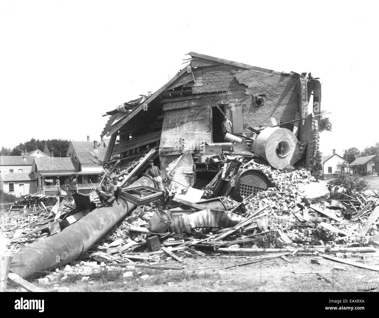 The image depicts the aftermath of a destructive explosion at the ...
